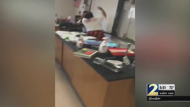 Video shows school staff members fighting in front of students in ...