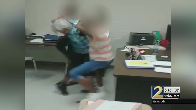 VIDEO: Teacher is repeatedly slapped during fight between students | WSB-TV