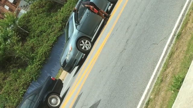 Video shows man get out of car, slap another driver through her window ...